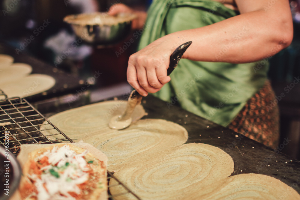 Making Khanom Buang - Thai traditional dessert, crispy pancake made ...
