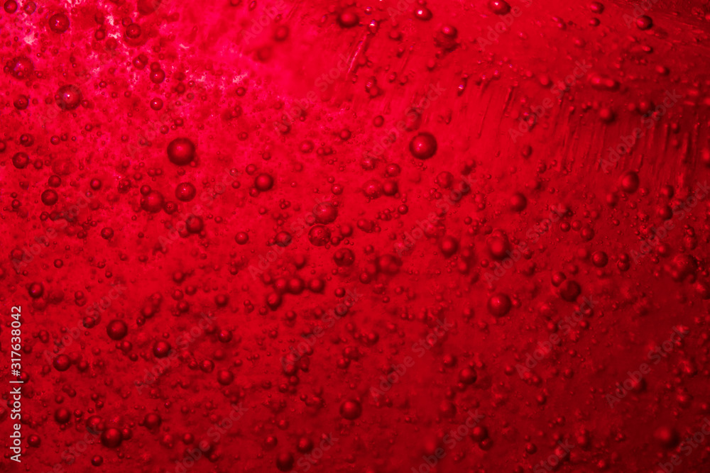 red bubble floating to the top of liquid Stock Photo | Adobe Stock