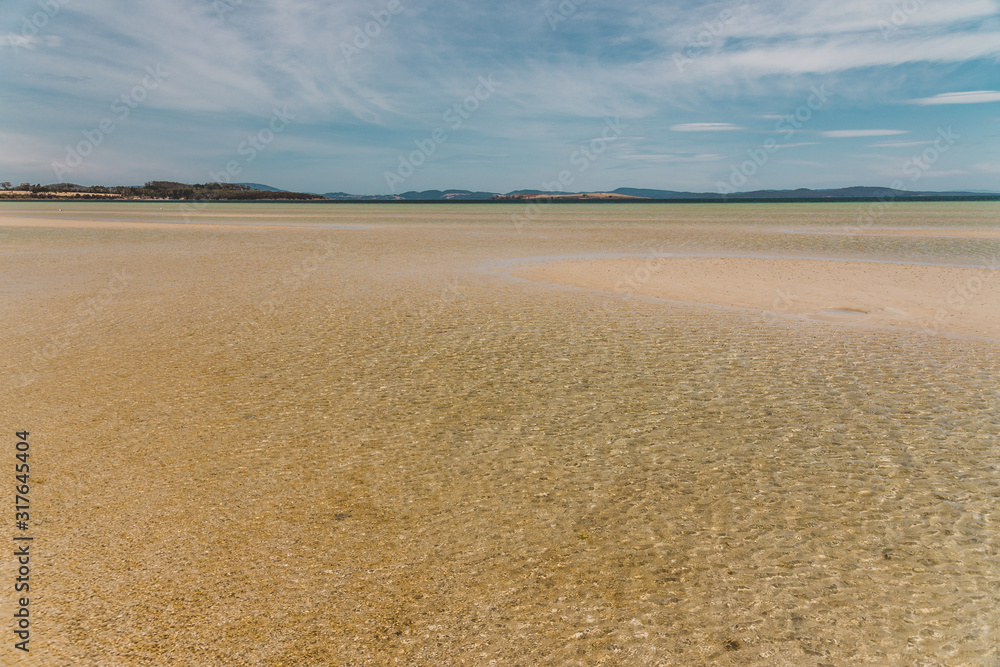 view of Dunalley Beach in Tasmania, Australia with sandbanks and ...