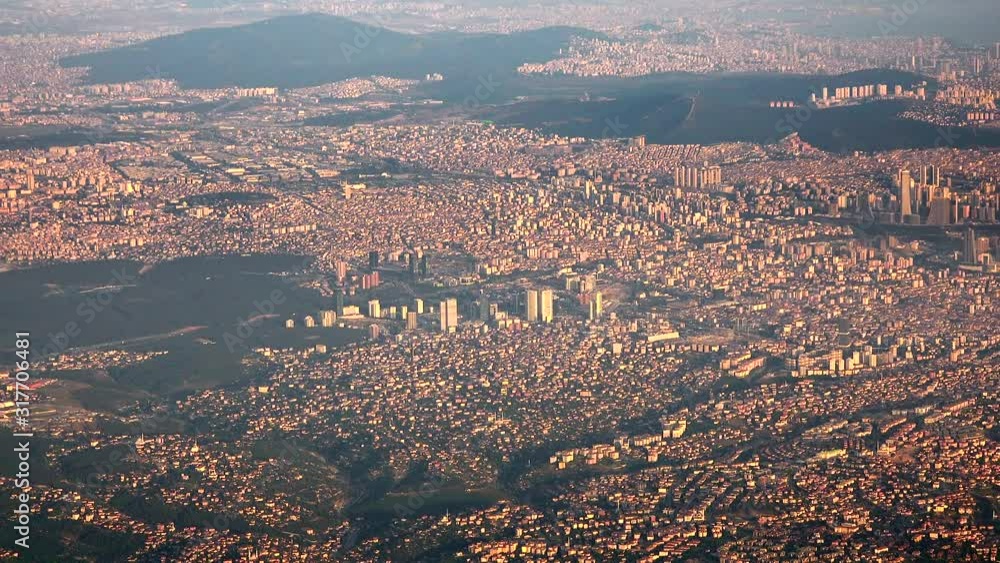 Overpopulated metropolis. Crowded congested city from airplane. Mosques ...