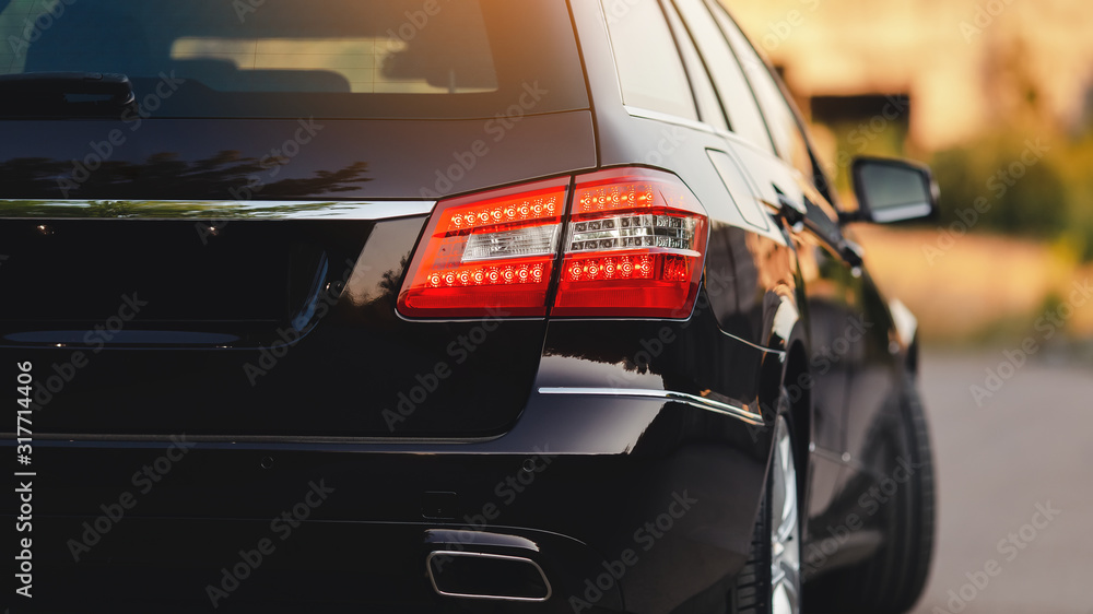 Touring car tailing lights. The back of a modern car. Stock Photo ...