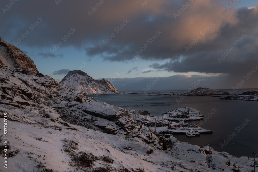 typical lofoten islands view. fishin town with mountains in backround ...
