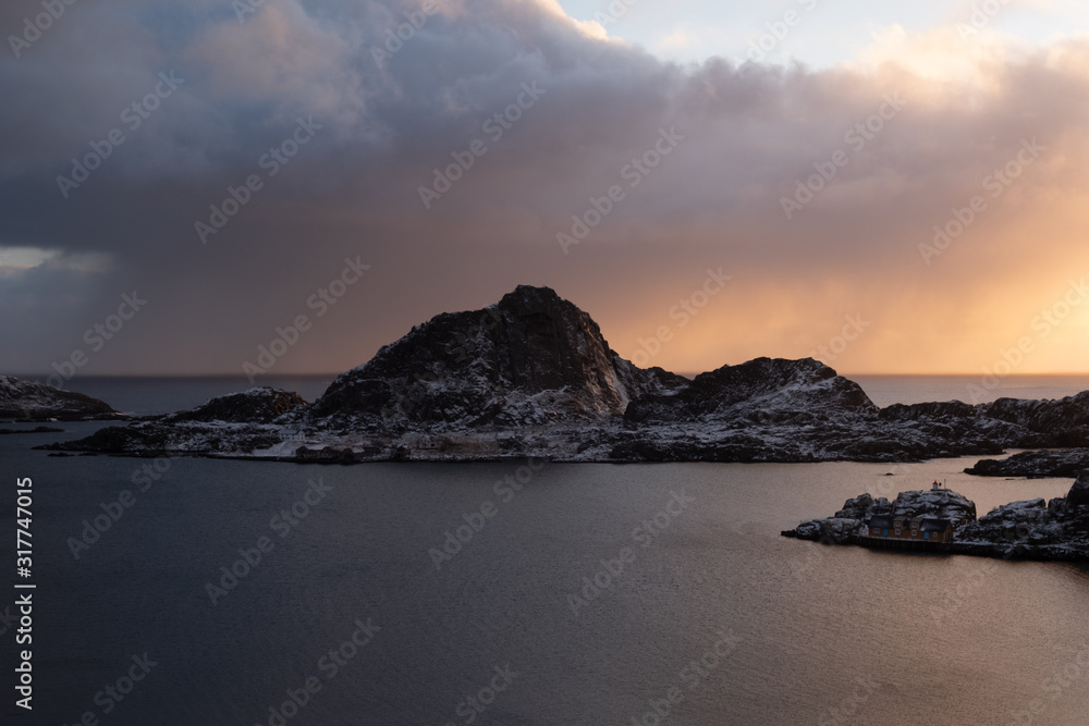 typical lofoten islands view. fishin town with mountains in backround ...