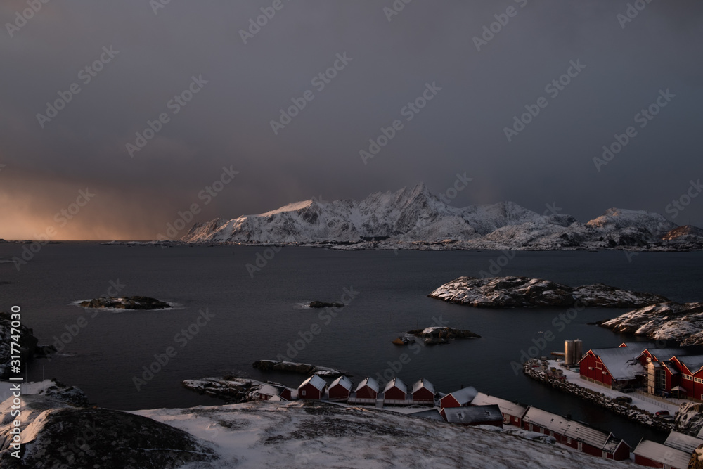 typical lofoten islands view. fishin town with mountains in backround ...