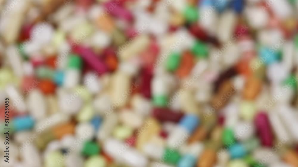 Shot focusing in and out on rotating pile of medicine pills Stock Video ...