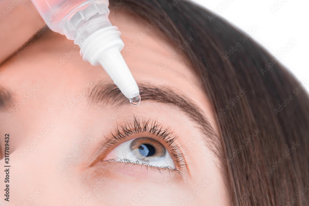 Closeup female hand is holding little bottle with healing drops. Young ...