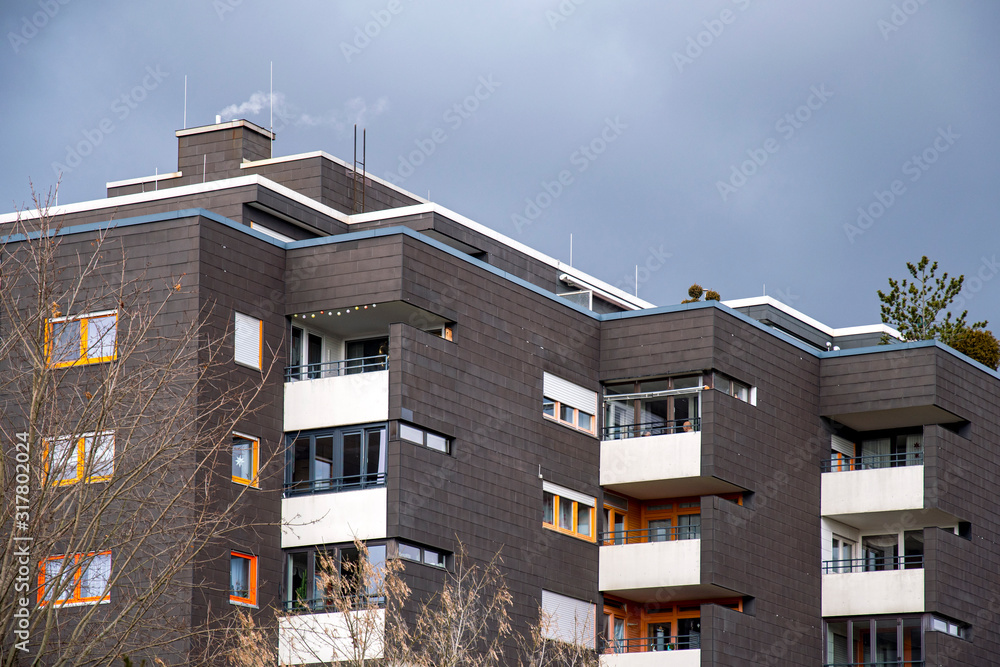 Panel construction with balconies and grey house cladding Stock Photo ...
