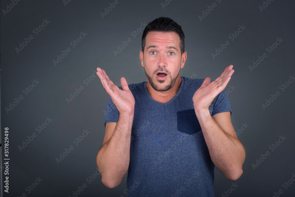 Surprise concept. Portrait of astonished handsome young man looking ...