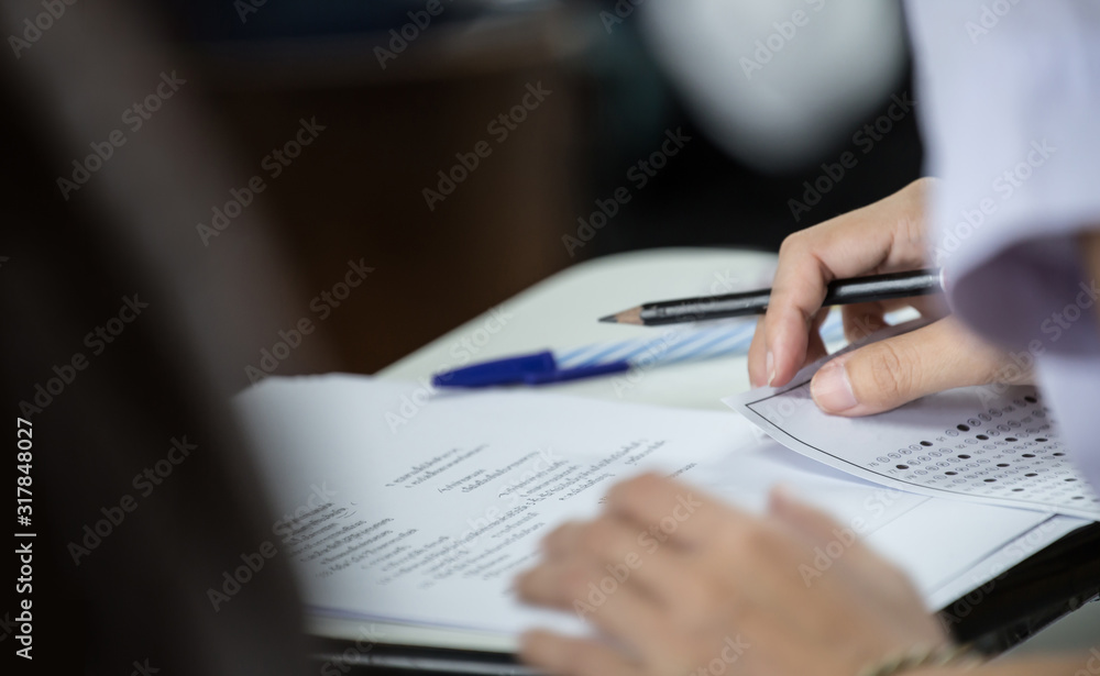 high school,university student study.hands holding pencil writing paper ...