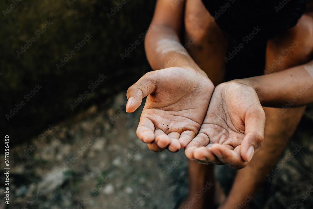 hands poor child or beggar begging you for help sitting at dirty slum ...
