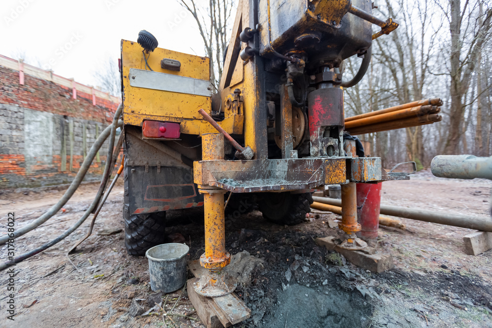 Hydraulic ground water hole drilling machine installed on the old truck ...