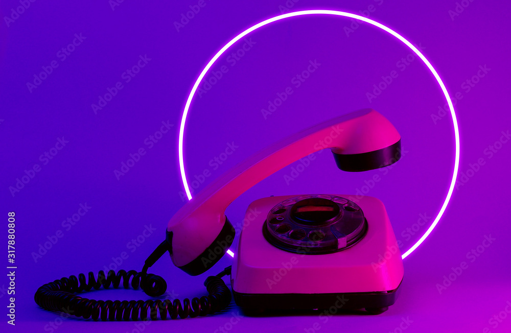 Old style rotary telephone with soaring telephone handle. 80's synth ...