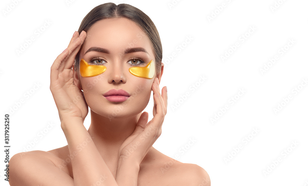 Woman with under eye collagen gold pads, beauty model girl face with ...