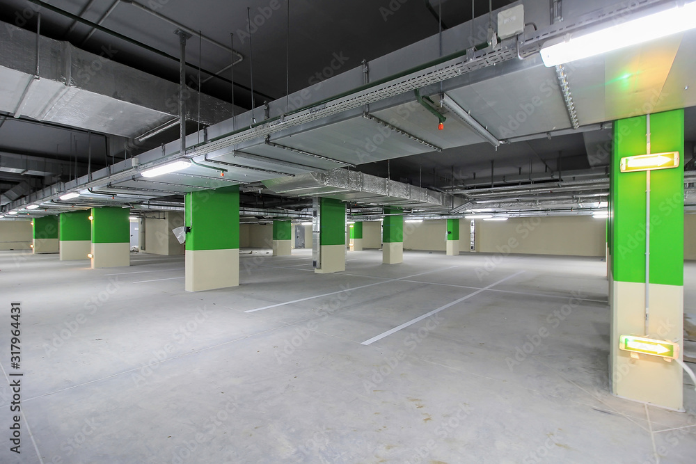 Underground parking in construction phase. Empty garage in basement of ...