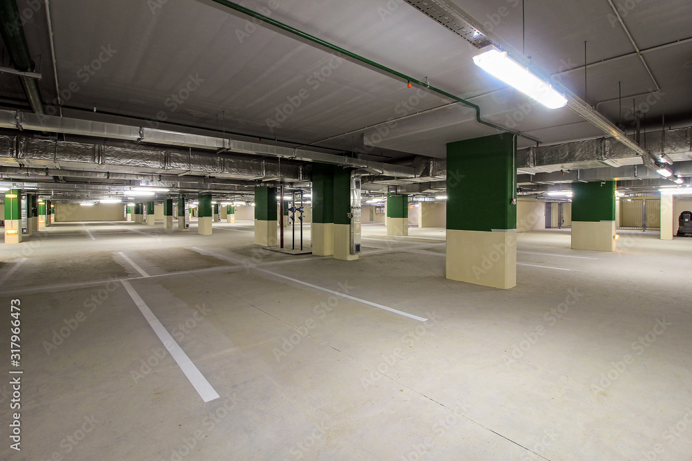Underground parking in construction phase. Empty garage in basement of ...