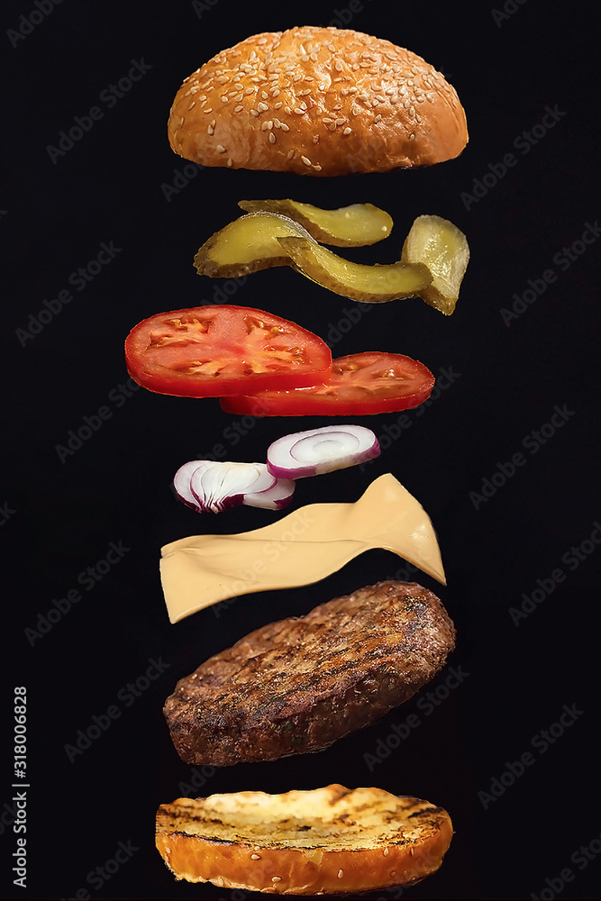 parts of burgers on a black background Stock Photo | Adobe Stock