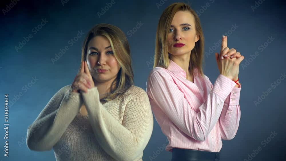 Two pretty female secret agents on dark blue background, agent officers ...