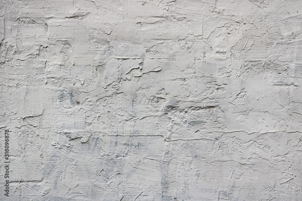messy white wall with irregular surface and contrast of textures ...