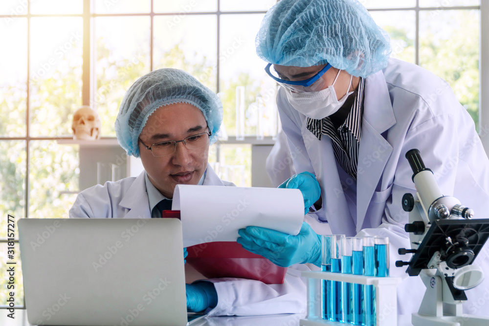 Young asian woman and senior man researcher scientist with laptop, lab ...