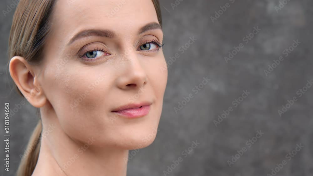 Pretty female model tender smooth skin posing at black studio ...