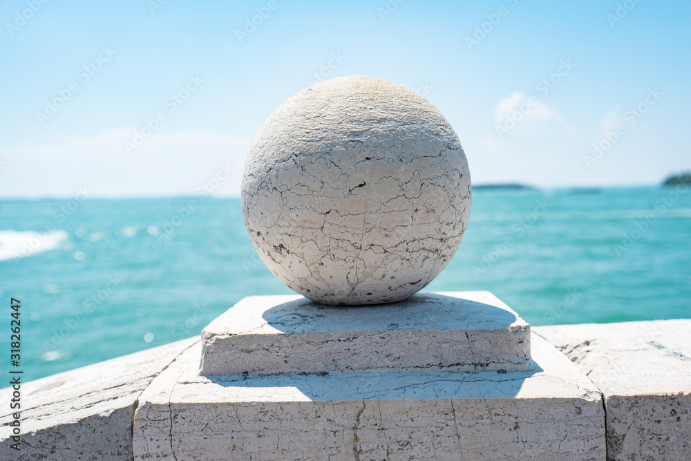 Stone Bridge Balls. Stone balls on bridge parapet on blue Lagoon in ...