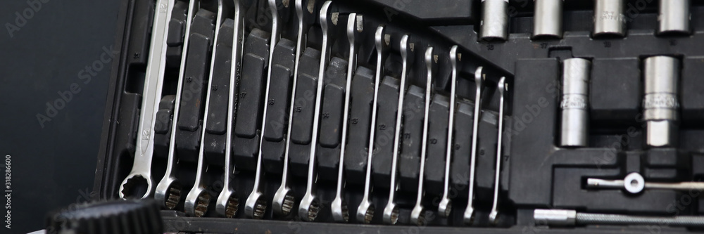 Focus on different metal shiny tools stacked in strict and right order ...