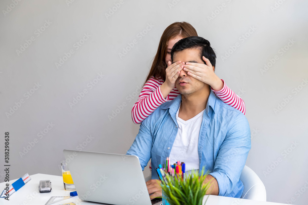 Daughter playing closing her father eye with hand, surprise greeting ...