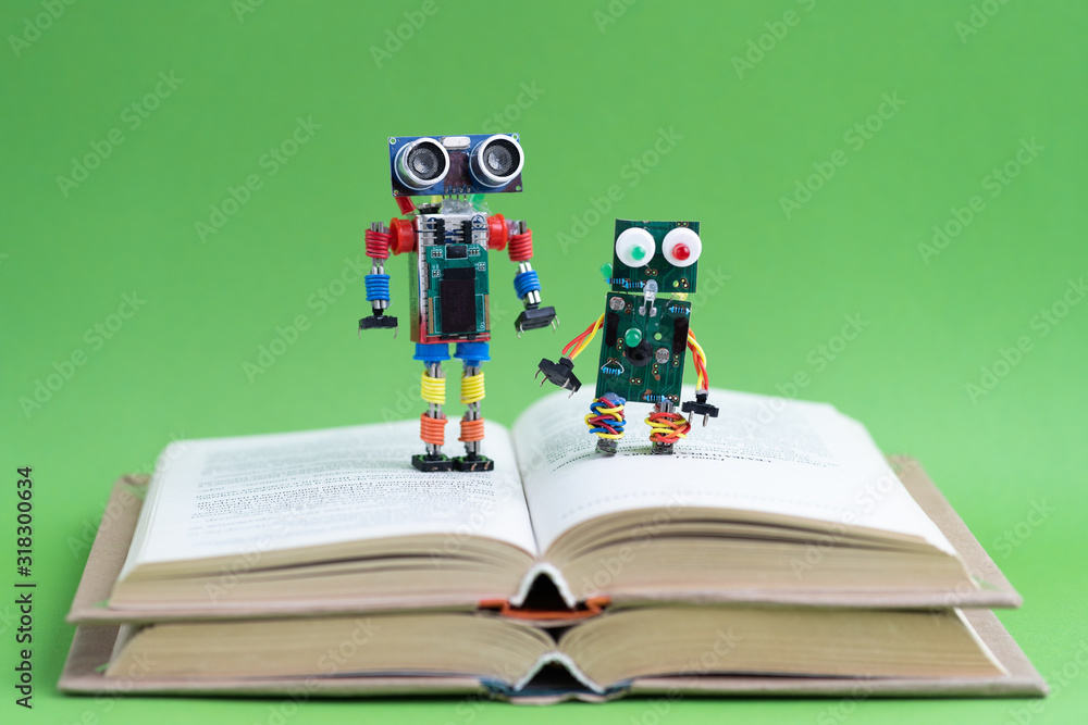 Hand made robot working on the arduino platform with books. Green ...