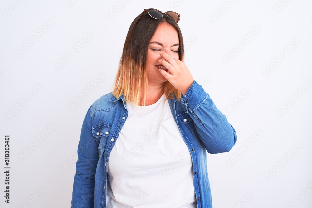 Beautiful woman wearing denim shirt standing over isolated white ...