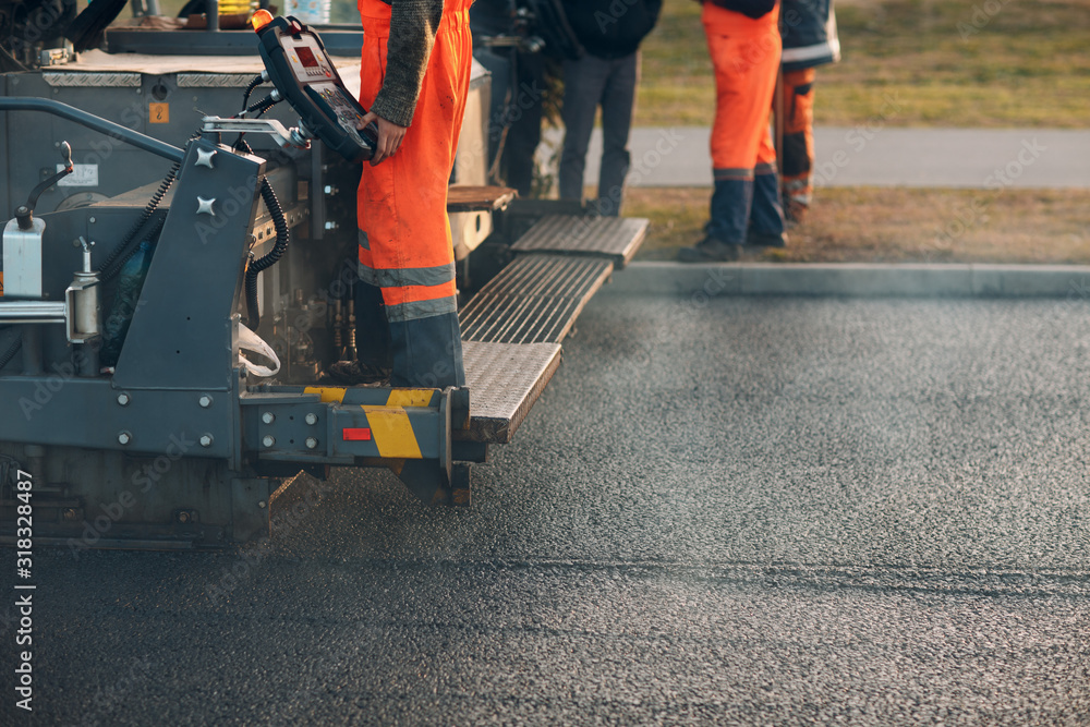 Asphalt paving. Paver machine and road roller. New road construction ...