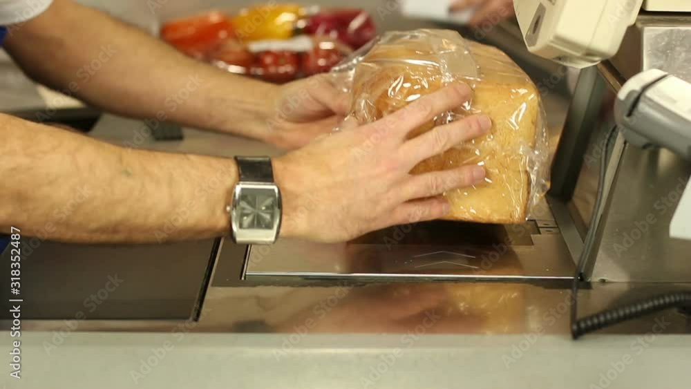 Scanning Groceries barcodes at the Cash register in the supermarket ...