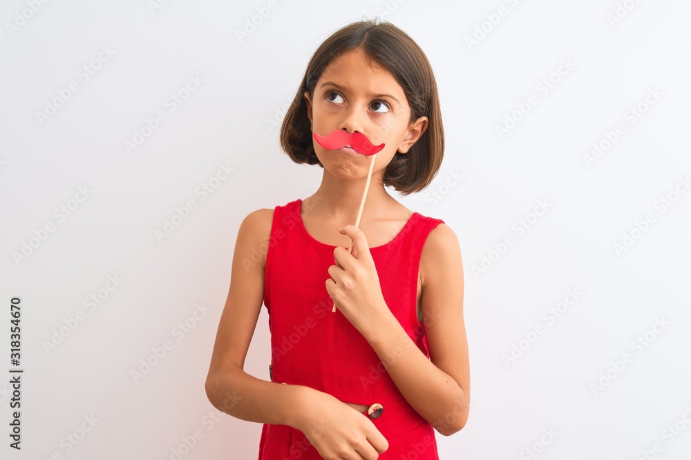 Beautiful child girl holding fanny party mustache standing over ...