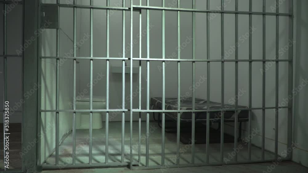 Empty Prison cell & Jail door. Camera Dolly Shot in Cellblock with no ...