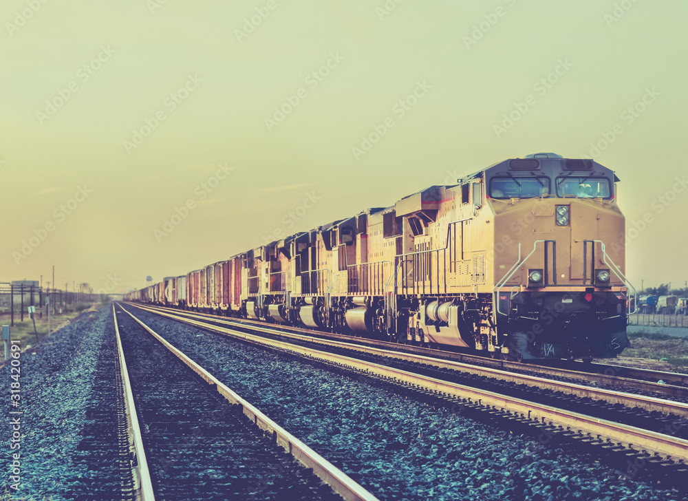 Freight Rail cargo train carrying heavy goods on long haul trip in the ...