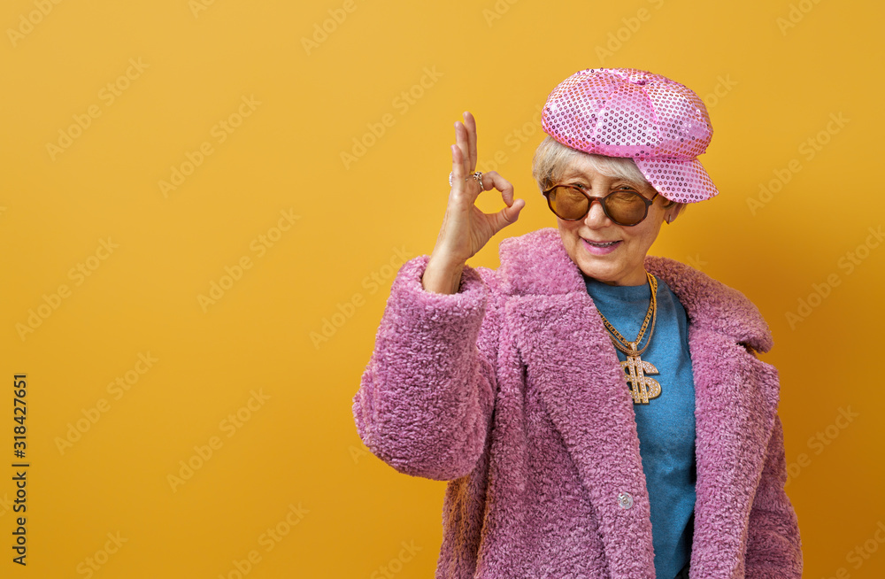 senior woman on color background Stock Photo | Adobe Stock