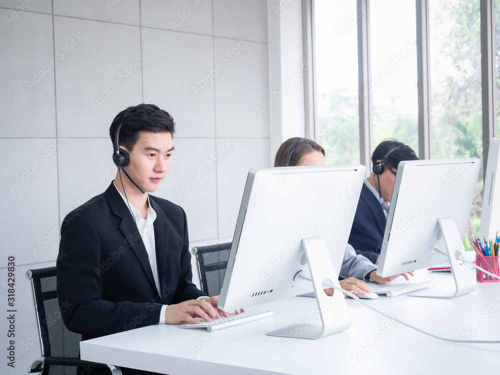 Customer service employee team with computer at the call center office ...