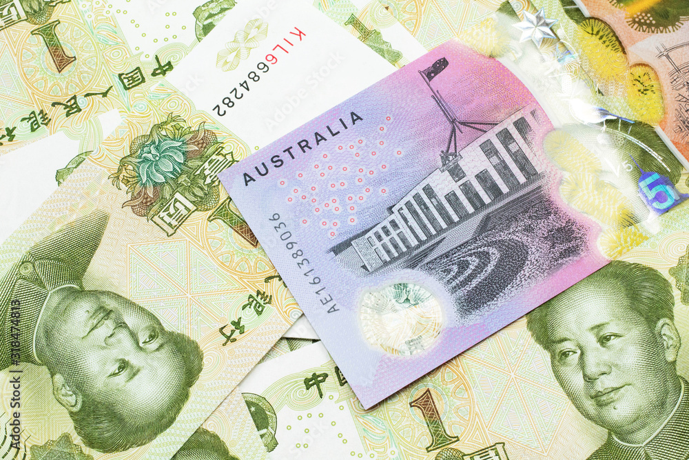A close up image of an Australian five dollar bill with Chinese one ...