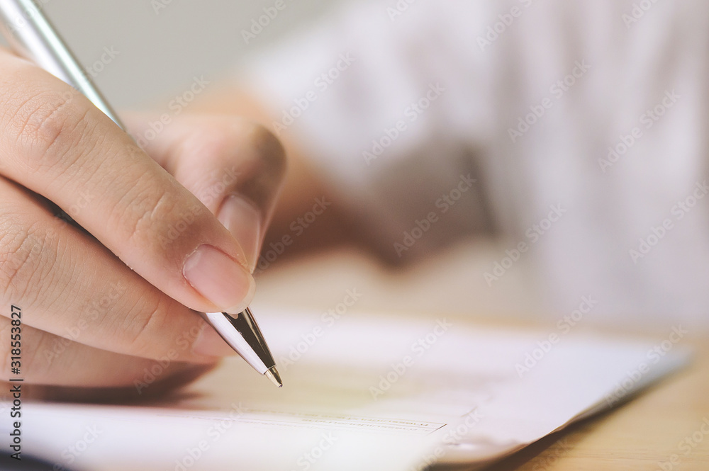 Hand of man signing signature filling in application form document ...