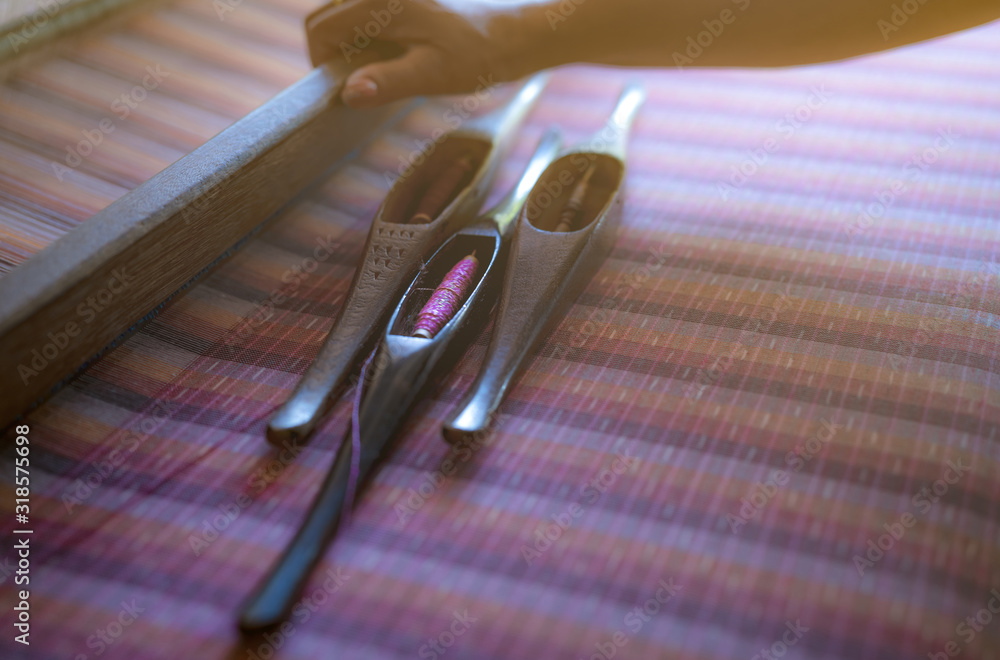 Woman working on weaving machine for weave handmade fabric. Textile ...