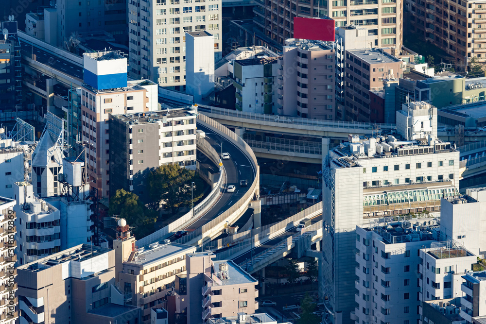 Japan. Flyover in residential areas of Tokyo. Cars drive on the ...