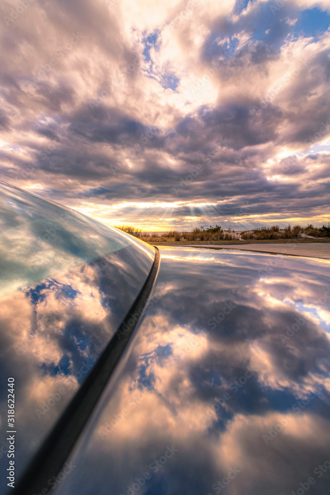 Sunset lighting up low cumulus clouds in vibrant colors, perfectly ...