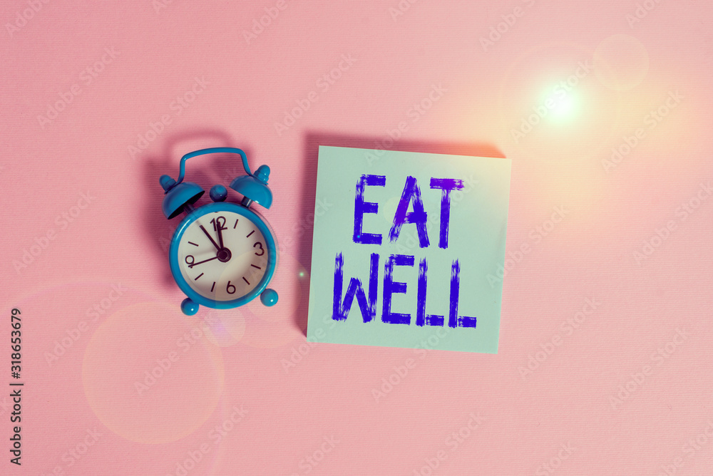Writing note showing Eat Well. Business concept for Practice of eating ...