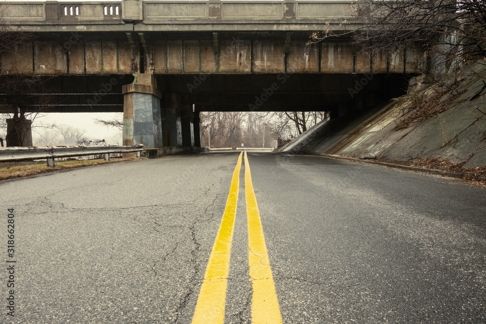 Urban road with bridge overpass. Black asphalt pavement street road ...