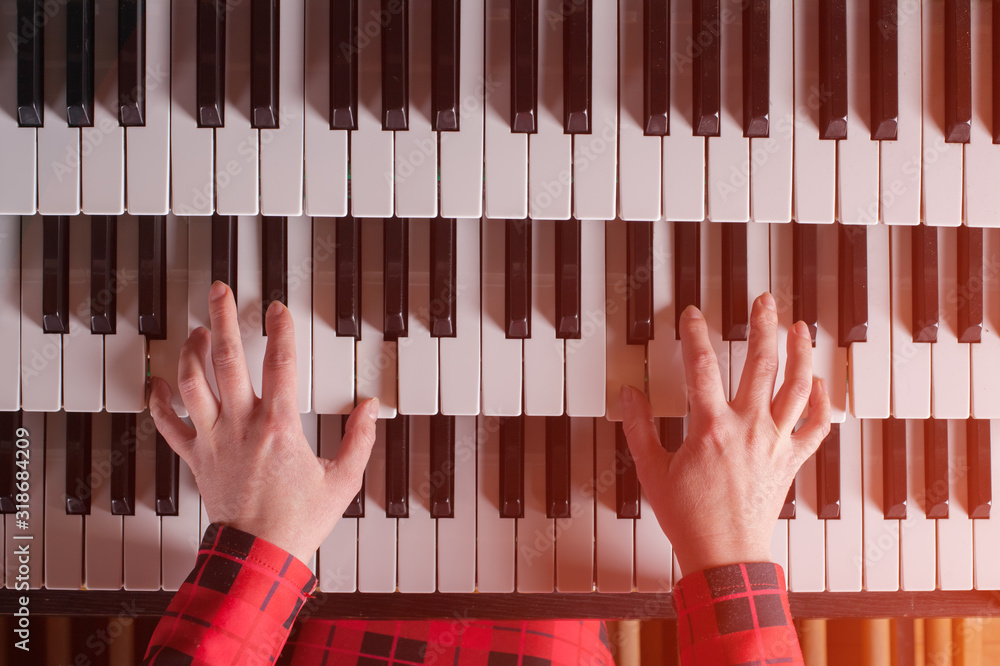 Organist playing a pipe organ, Top view Stock Photo | Adobe Stock
