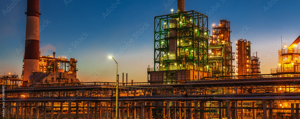 Oil petrochemical refinery factory or plant at twilight after sunset ...