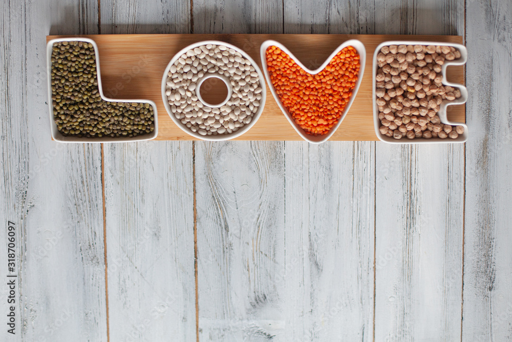 Bowls in the shape of letters LOVE of various legumes (green mung beans ...