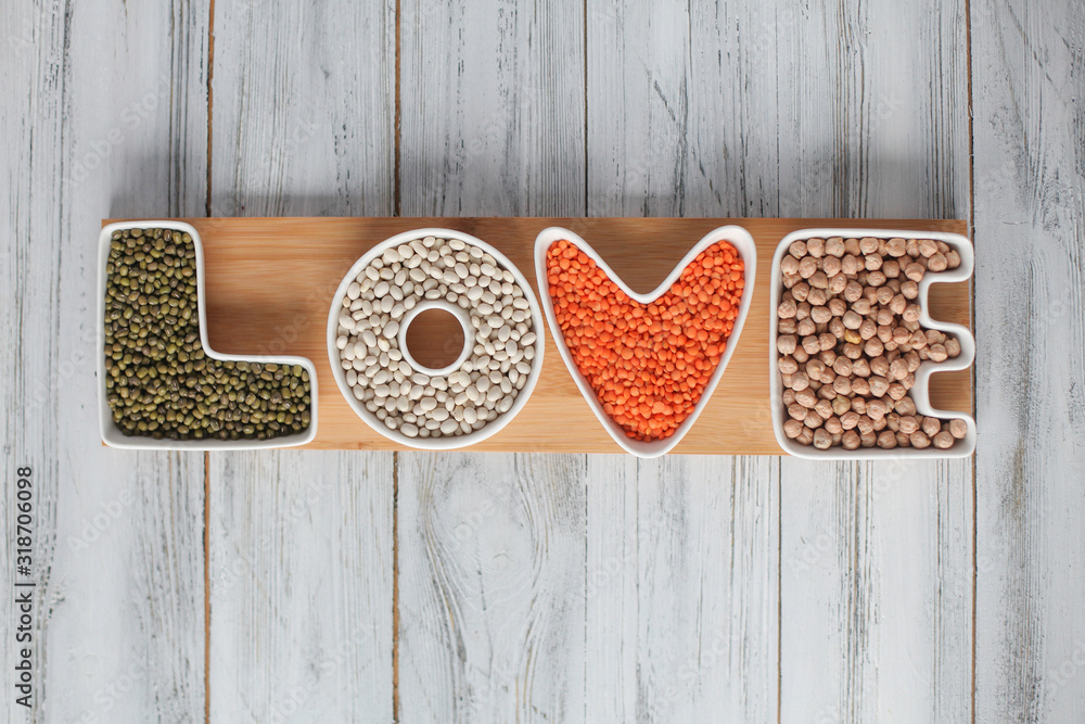 Bowls in the shape of letters LOVE of various legumes (green mung beans ...