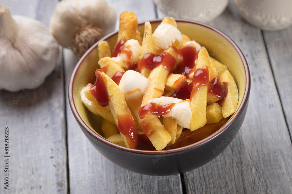 Canadian poutine potato fries with cheese and gravy Stock Photo | Adobe ...