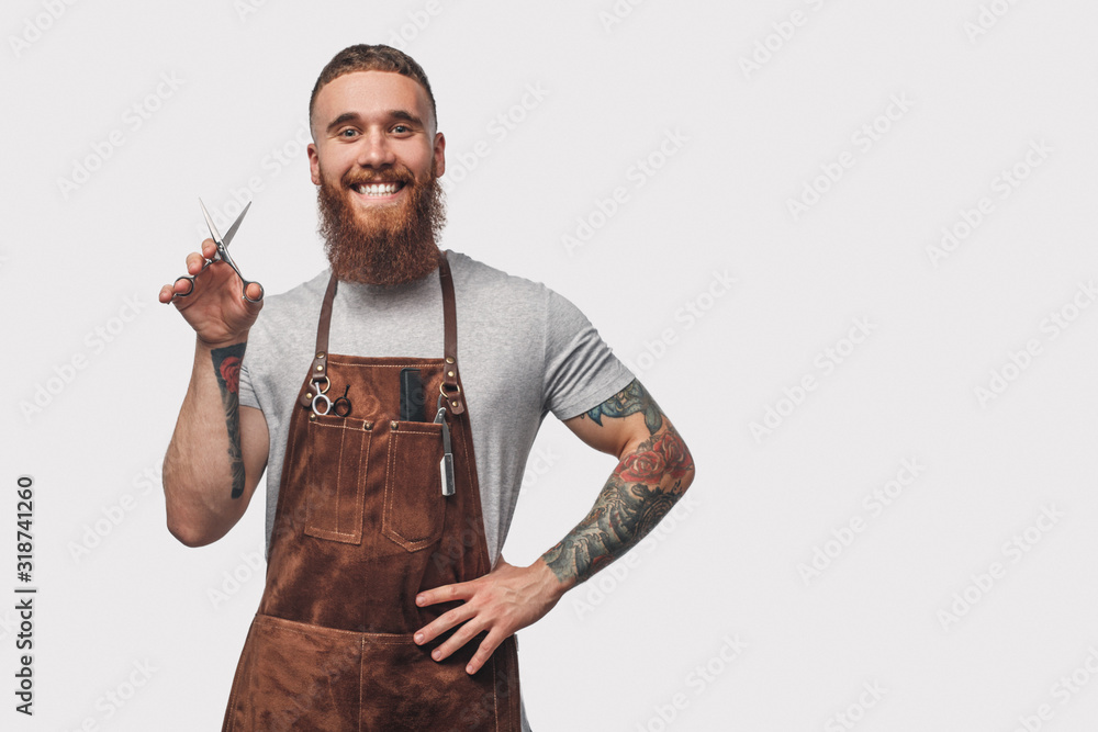 Positive barber with sharp scissors Stock Photo | Adobe Stock