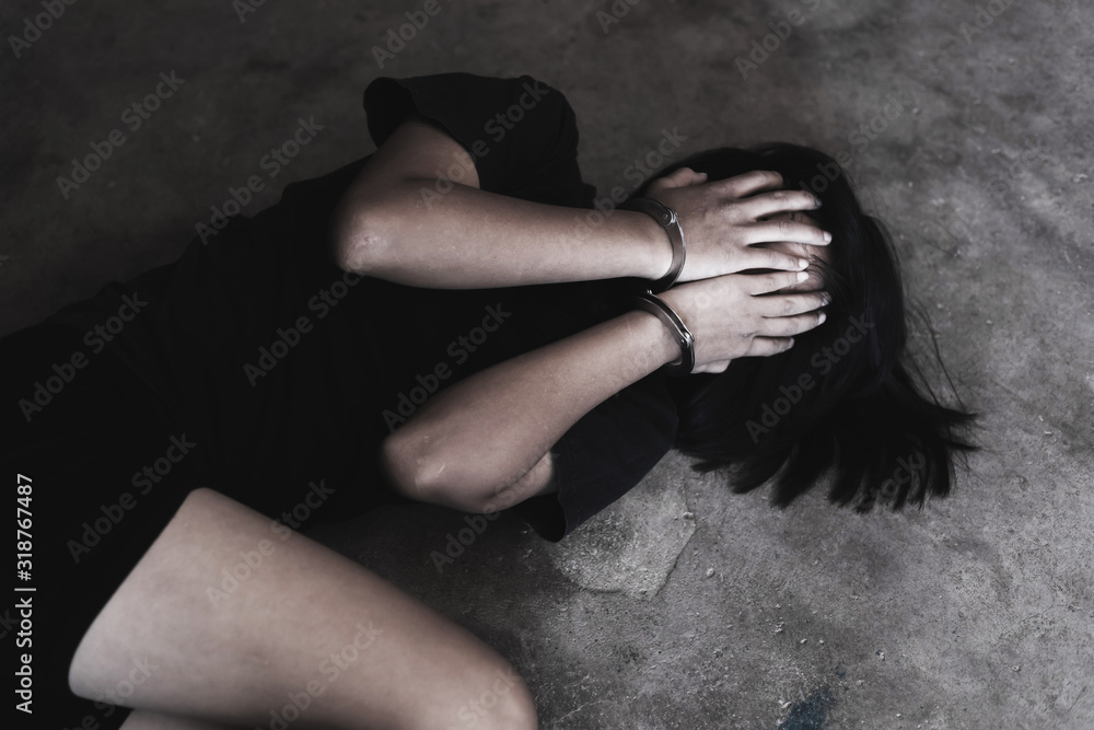 Kidnapped teen girl hands handcuffed. Abused and tortured concept ...